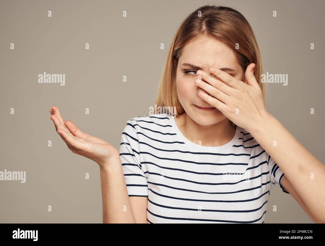 Upset woman model disgust emotions beige background portrait Stock ...