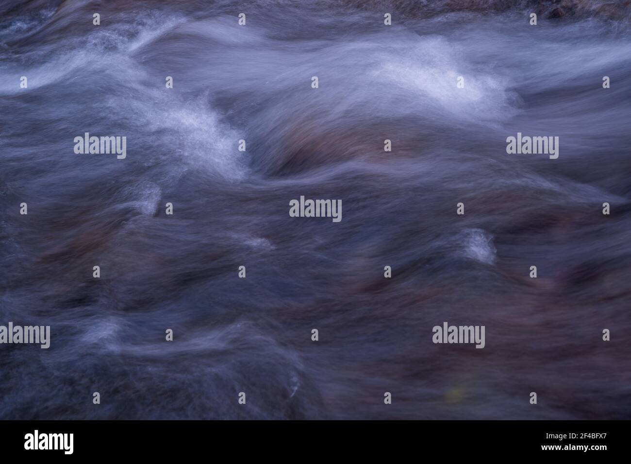 Water flowing over rocks. Long exposure. Abstract background. Beauty in ...