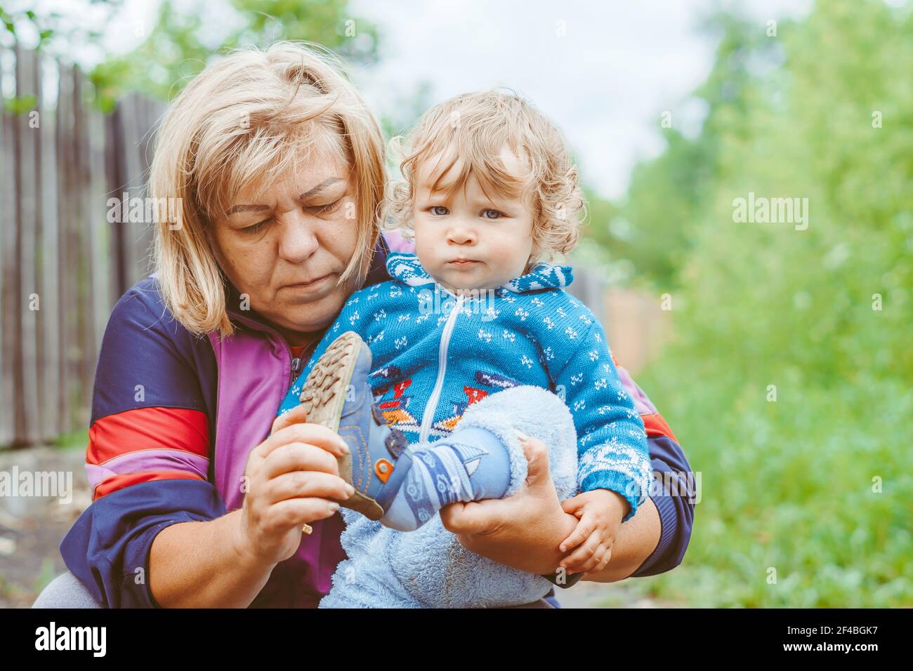 grandmother with a small grandson on a country plot Stock Photo - Alamy