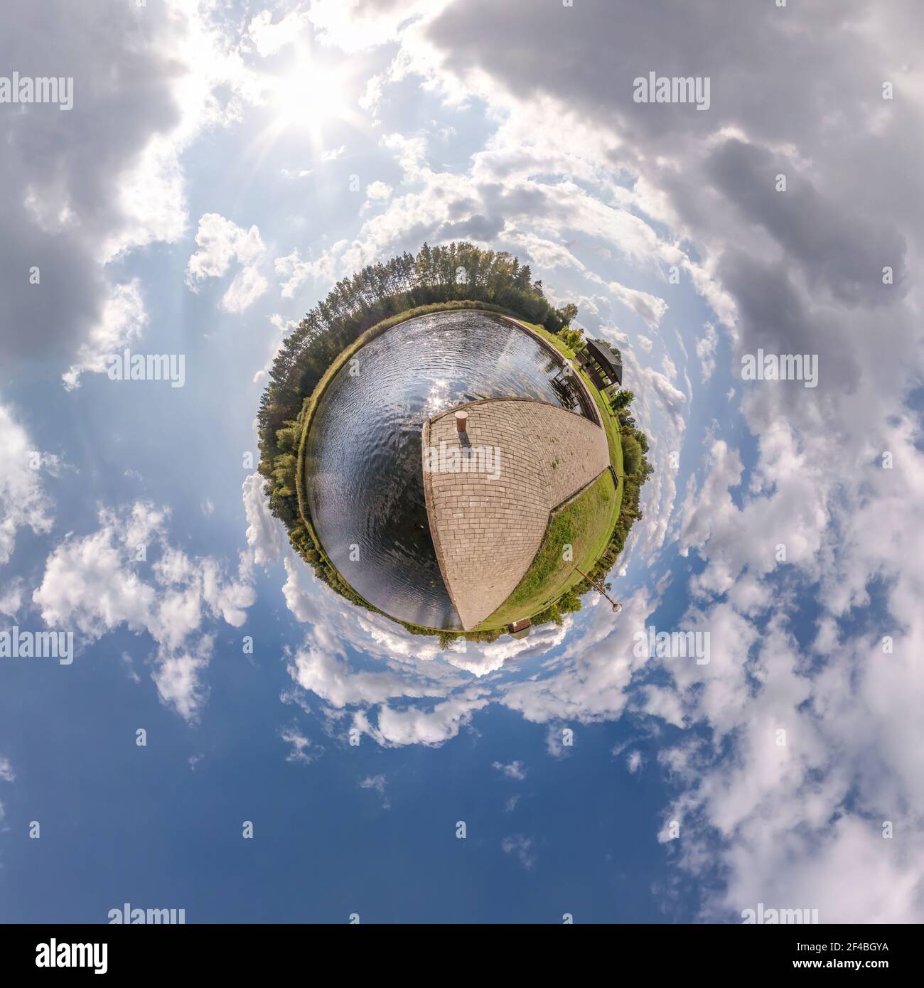 tiny planet in blue sky with sun and beautiful clouds. Transformation ...