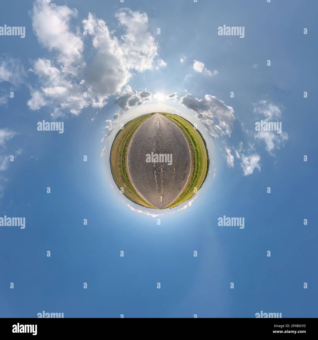 tiny planet in blue sky with sun and beautiful clouds. Transformation ...