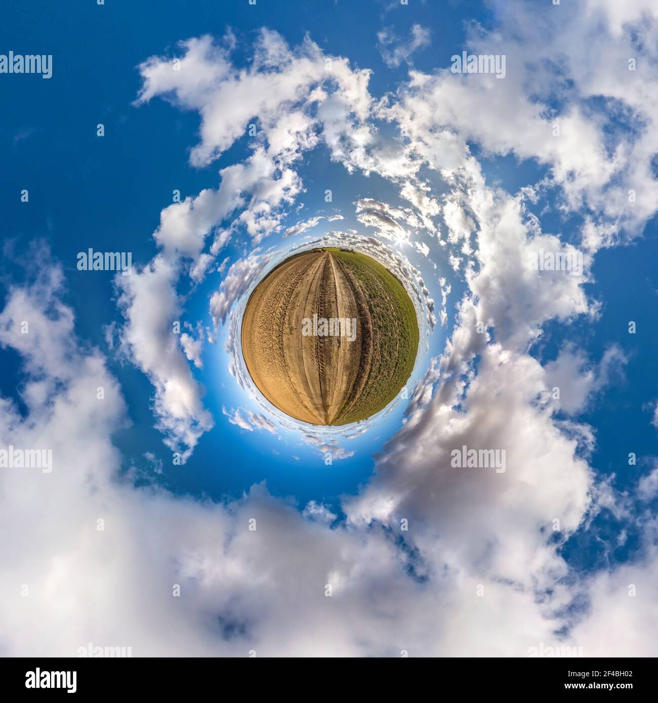 tiny planet in blue sky with sun and beautiful clouds. Transformation ...