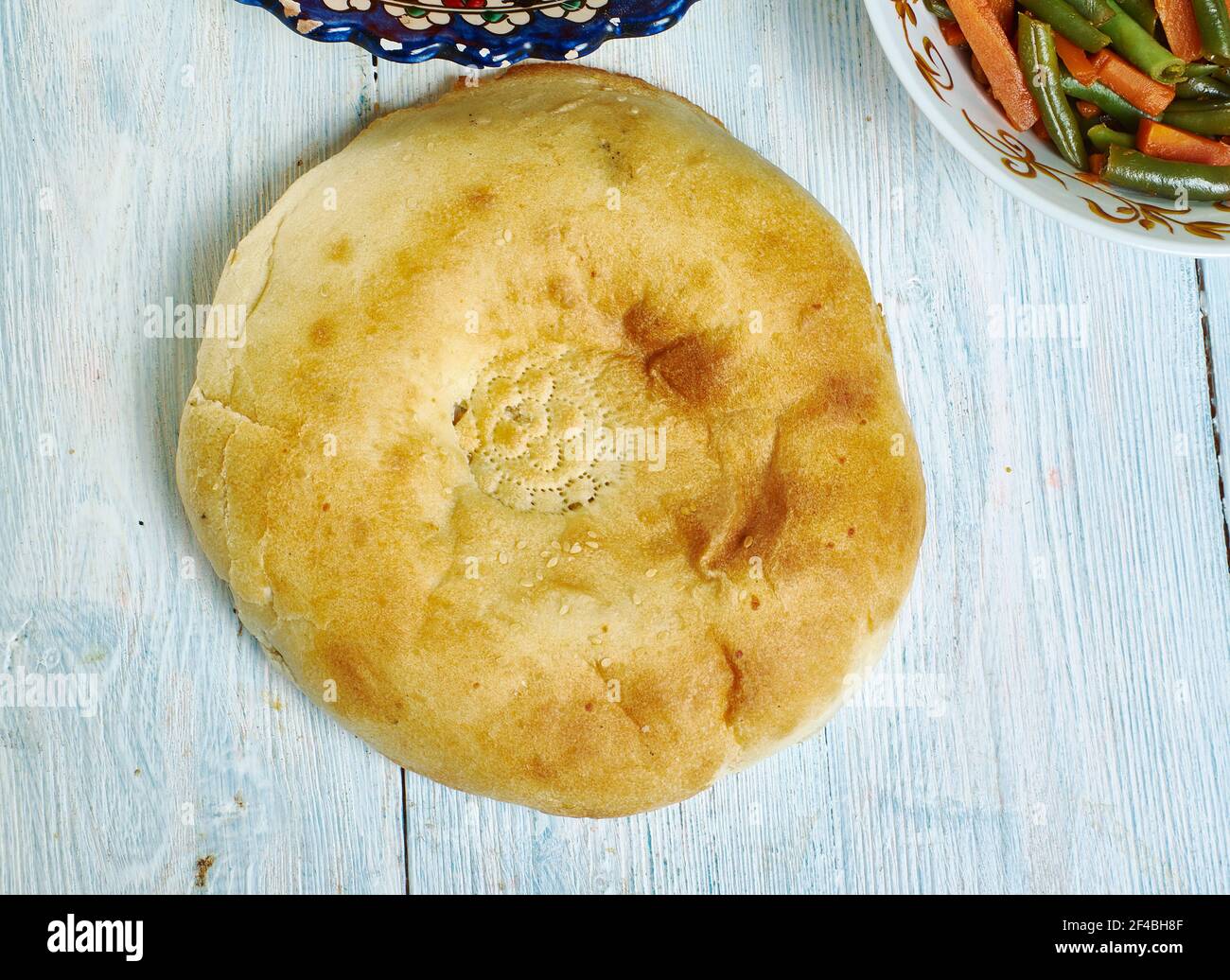 Tandyr nan, of flatbread in Afghan, Tajik and Uzbek cuisin,e type of ...