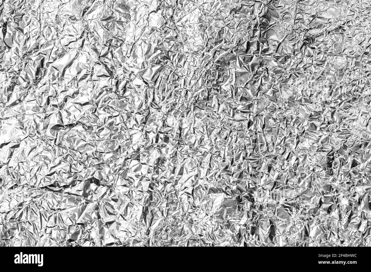 Texture of crumpled aluminum kitchen foil. Silver foil with shiny ...