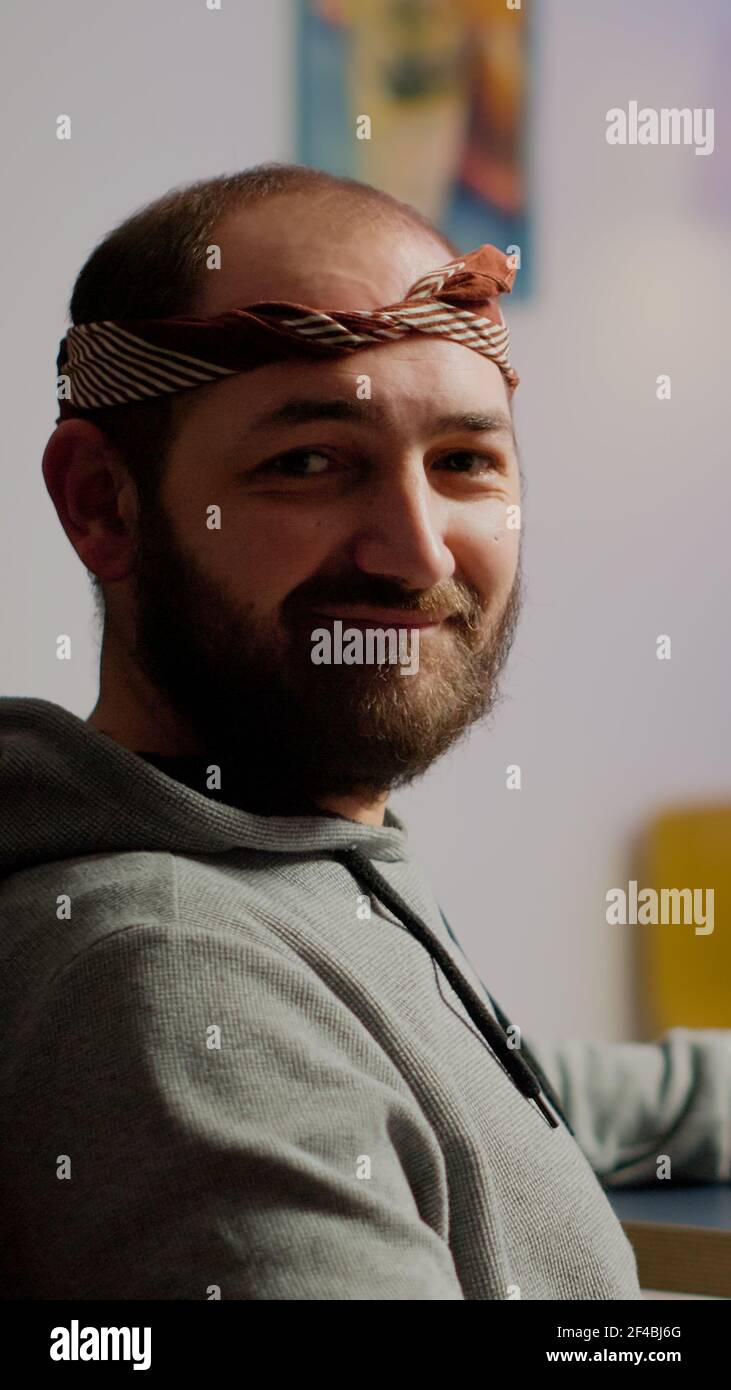 Pro cyber man looking at camera before playing space shooter videogames ...