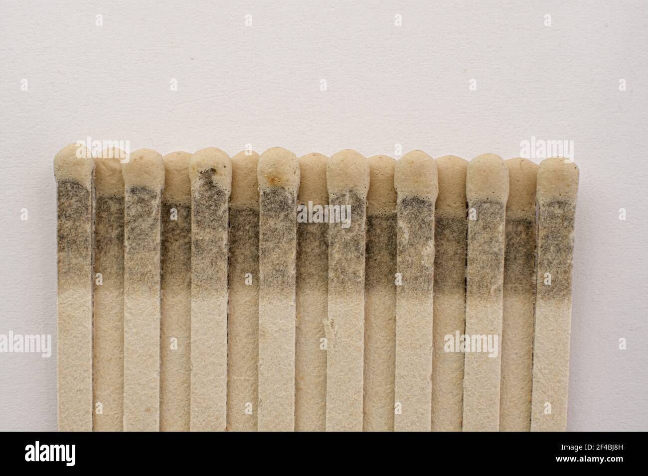 matchsticks on a white paper Stock Photo - Alamy
