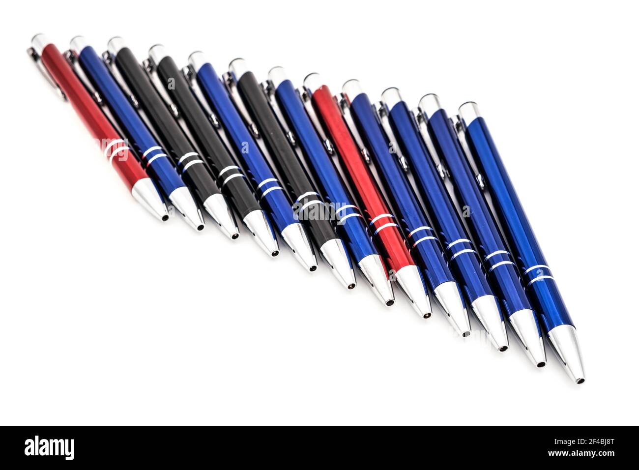 metal pens arranged on white background Stock Photo - Alamy