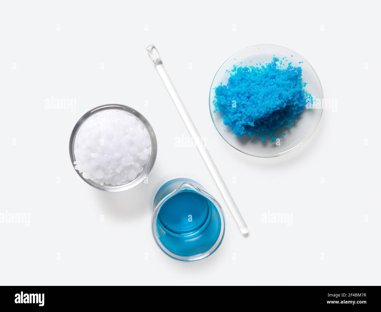 Inorganic chemical placed next to the Stirring Rod on white laboratory ...