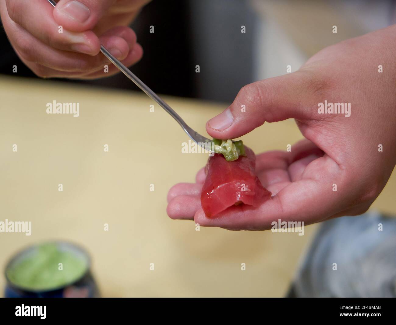 Japanese chef use Spatula to scoop Wasabi Zuke onto Agami sushi. Enjoy ...