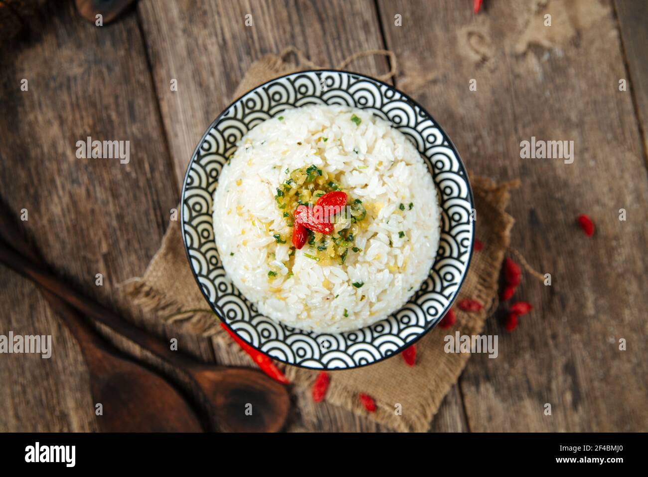 Herbs and bowl of cooked rice hi-res stock photography and images - Alamy