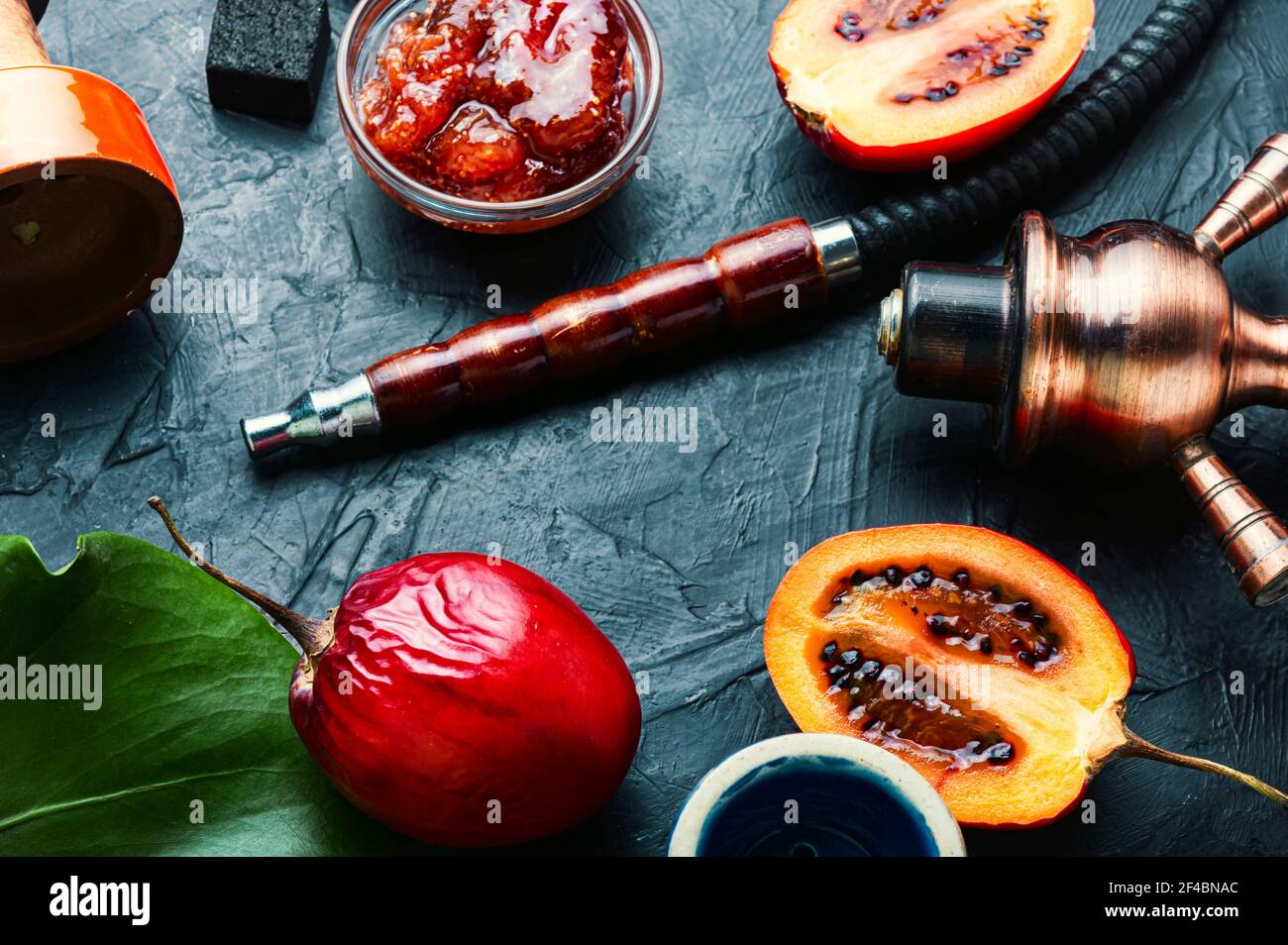 Smoking hookah with tamarilla flavor.Fruit hookah tobacco.Trendy hookah ...