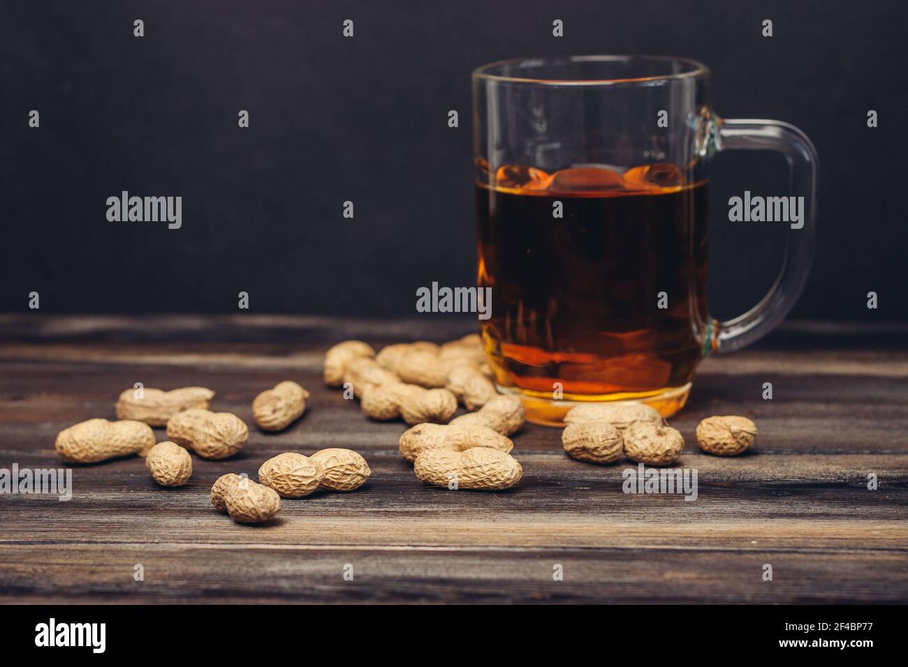 peanuts in shells beer mug bar counter alcohol pub Stock Photo - Alamy