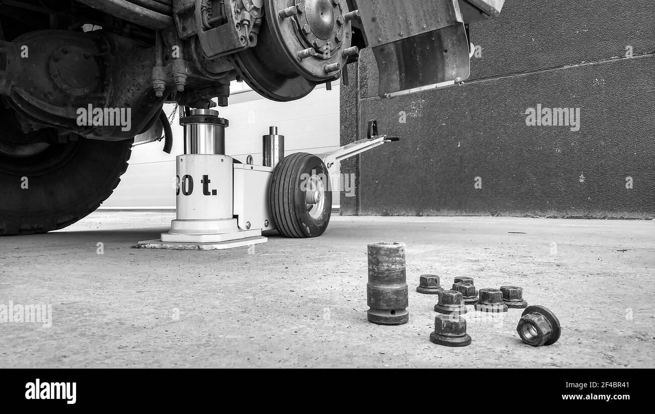 heavy duty off road truck propped up on a high jack without rear wheel ...