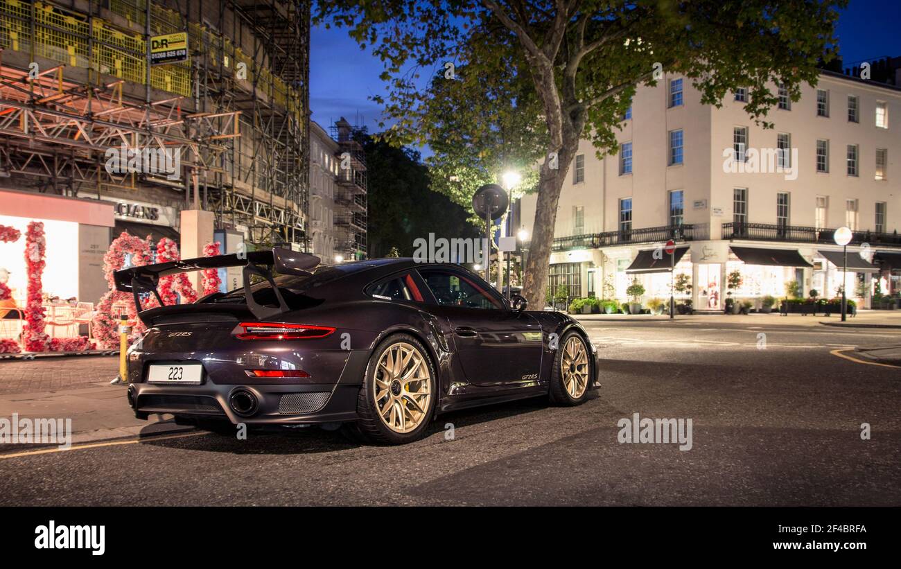 Purple Porsche 911 GT2 RS modern supercar parked on a street in Central ...