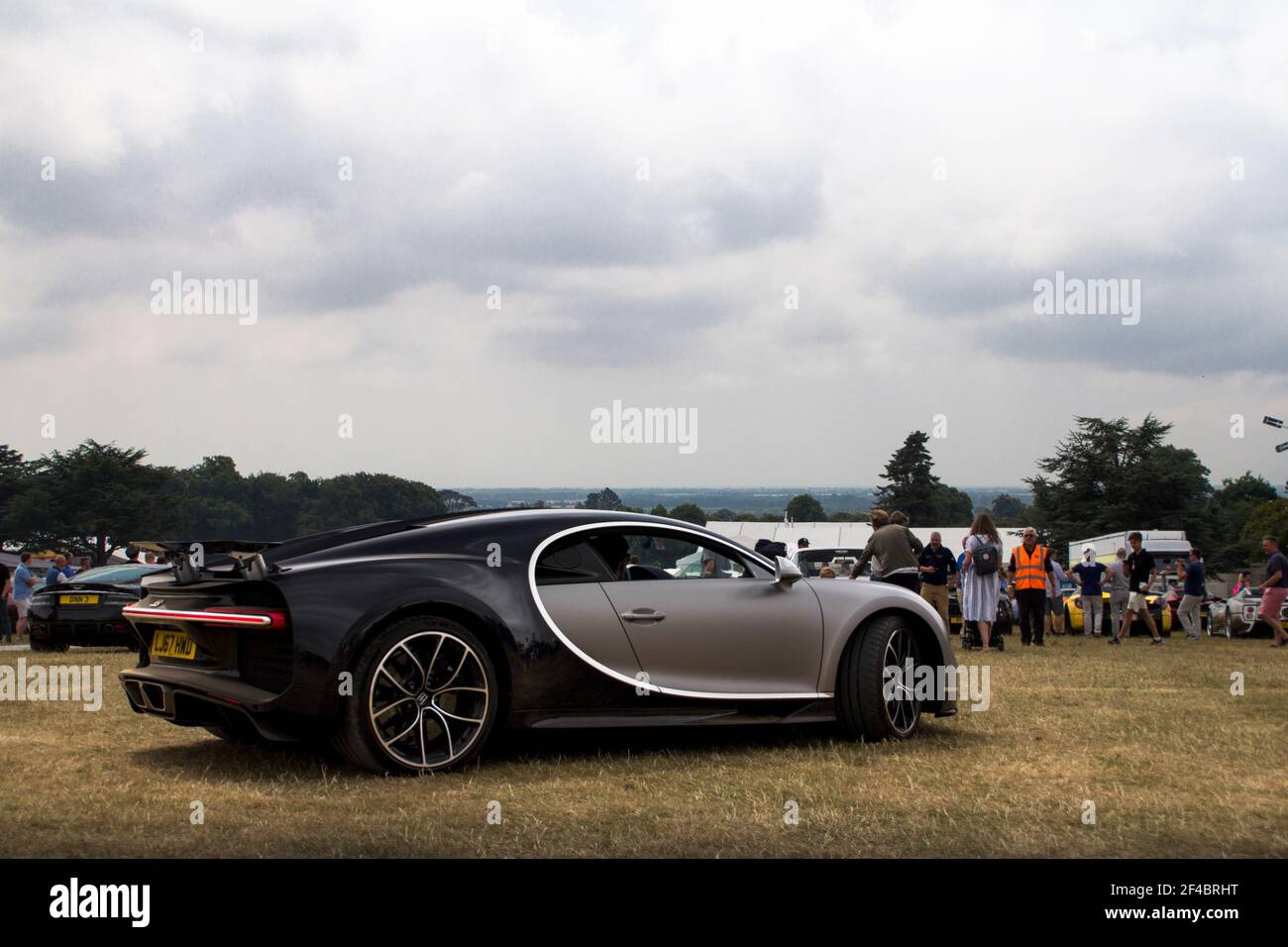 Silver with black Bugatti Chiron modern hypercar attending an annual ...