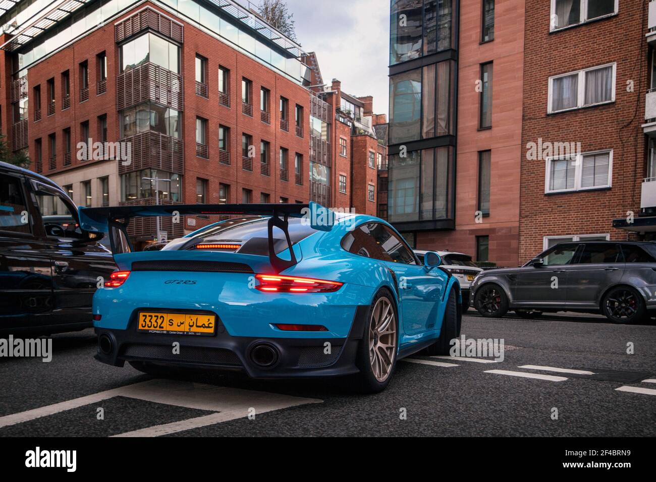Baby blue Porsche 911 GT2 RS modern supercar driven on a street in ...