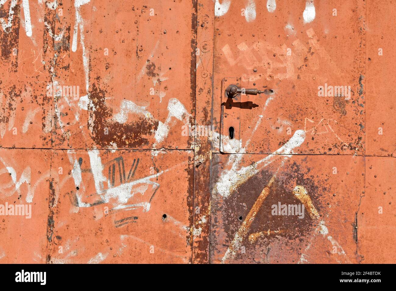 Old rusty metal door of a building Stock Photo - Alamy