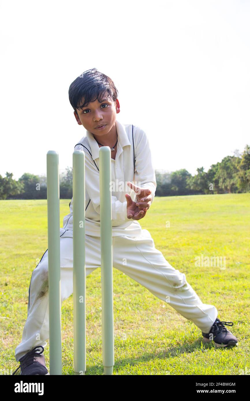 Cricket child fielding hi-res stock photography and images - Alamy