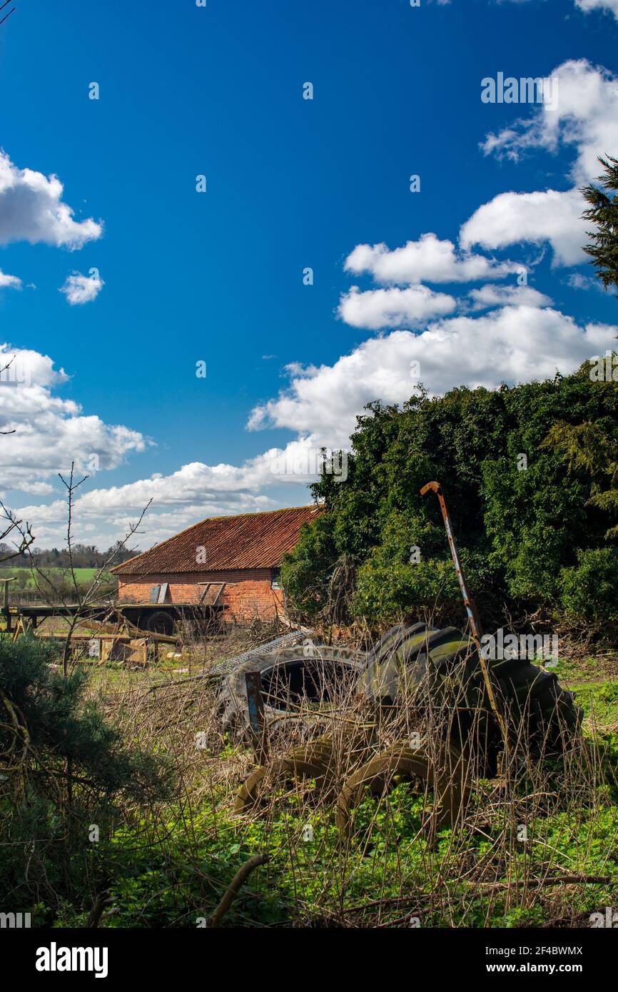 Old tracker tyre farm yard Stock Photo - Alamy