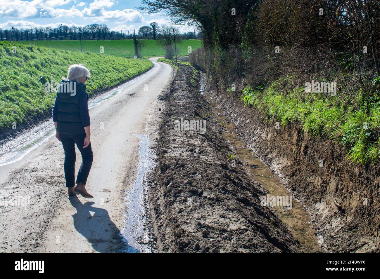 Newly cleaned, cleared road side ditch, stream, water Stock Photo - Alamy