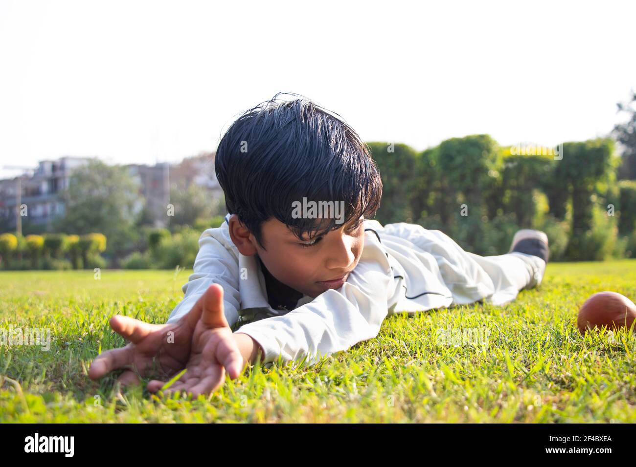 Kids playing cricket boy cricket player hi-res stock photography and ...