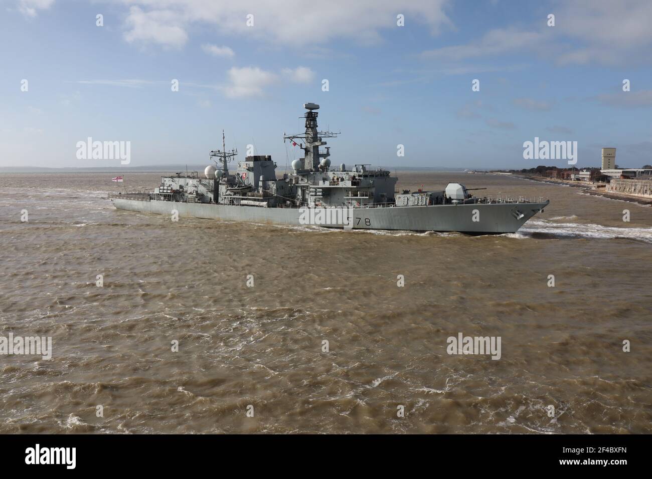 The Royal Navy frigate HMS KENT entering harbour. Strong winds in The ...