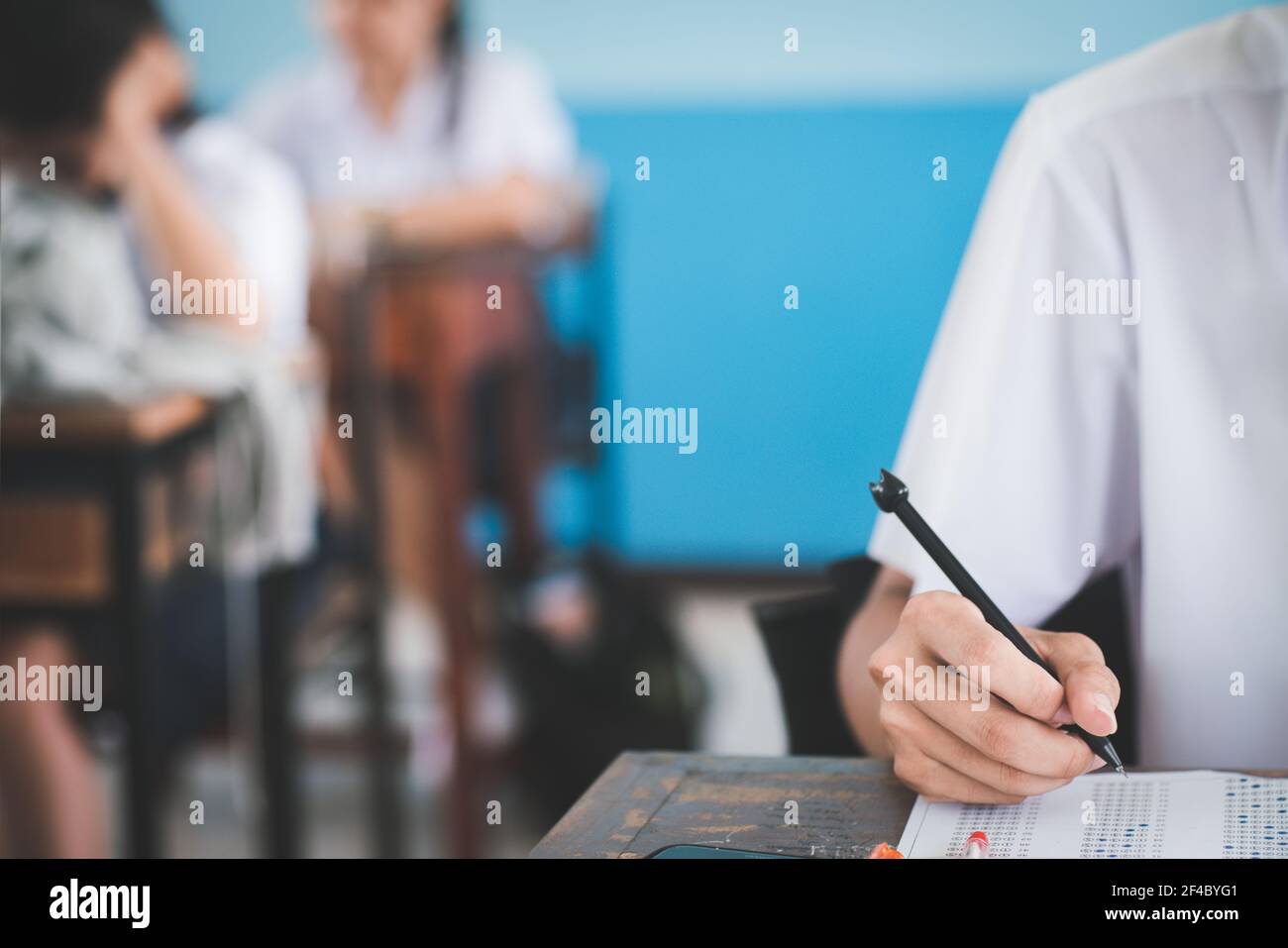 High school student taking exam uniform hi-res stock photography and ...