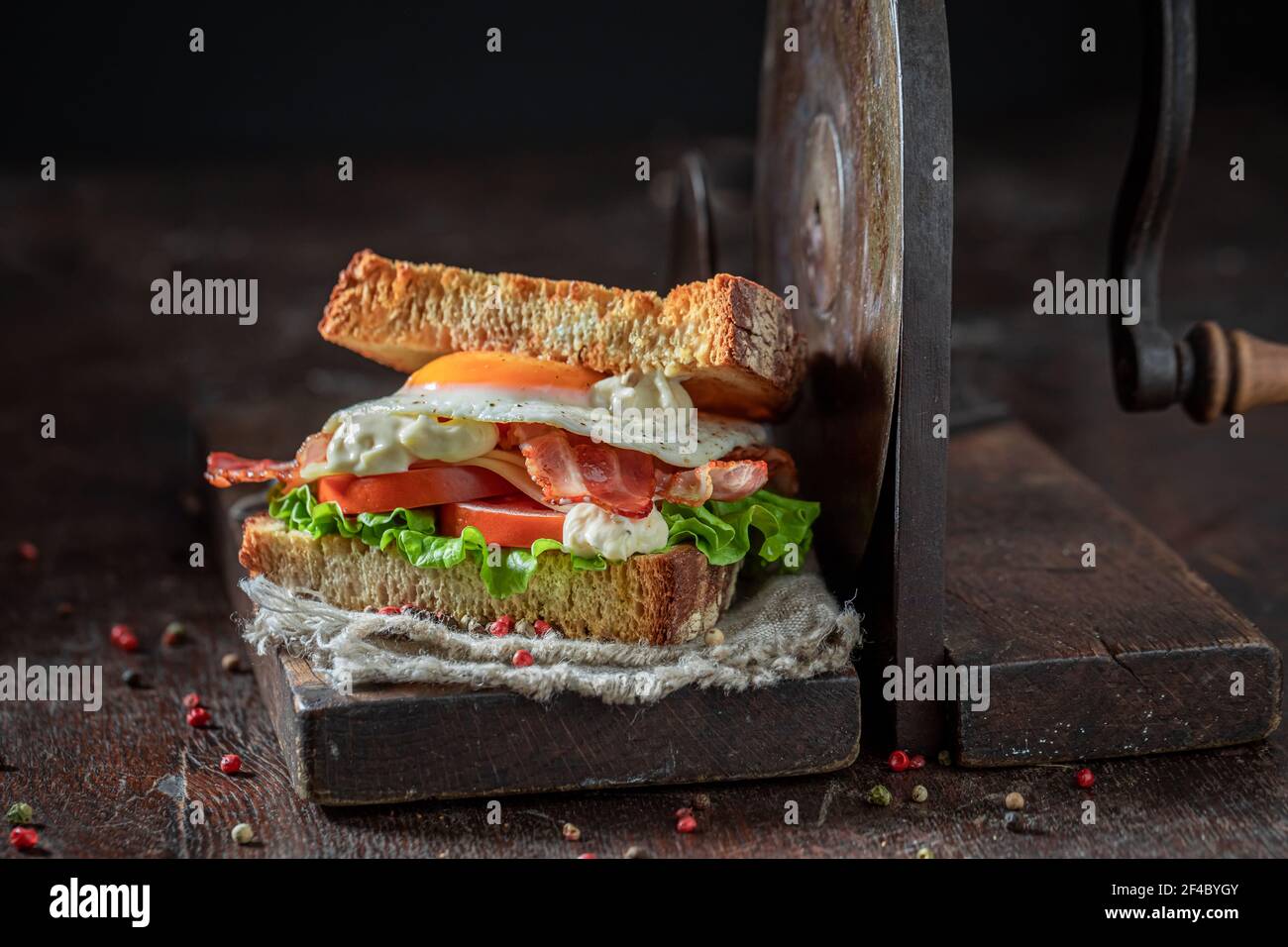 Crunchy toasted bread with bacon, egg and mayonnaise. British breakfast ...