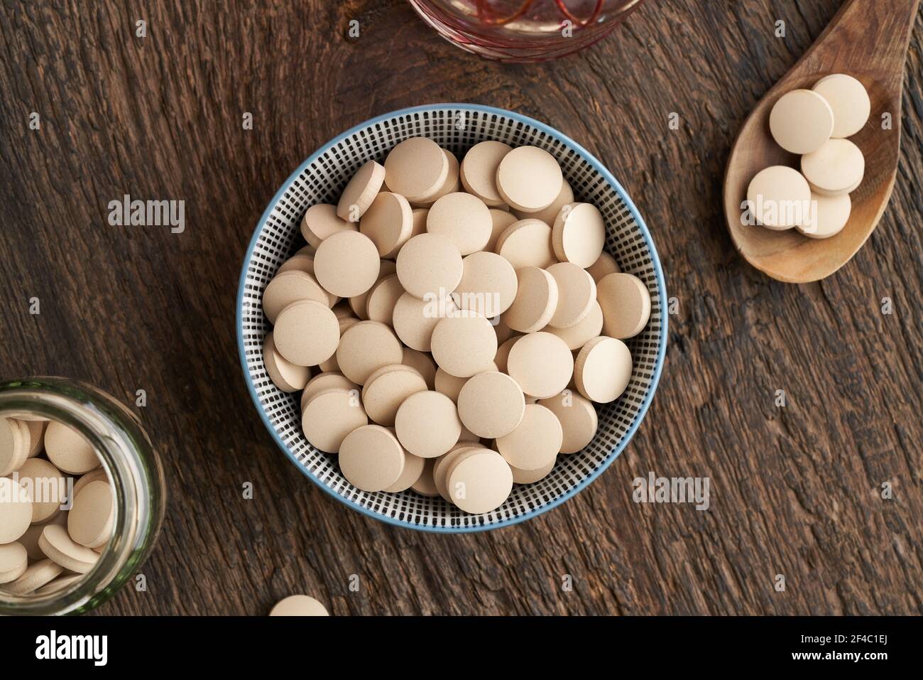 Brewer's yeast tablets in a bowl - nutritional supplement rich in ...