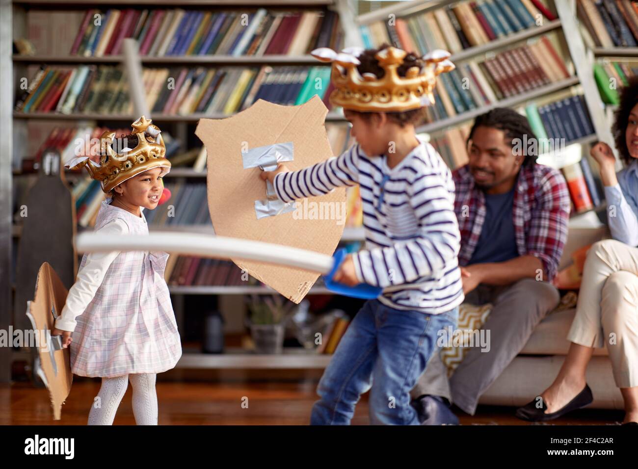Children dressed like knights are fighting with swords while being ...