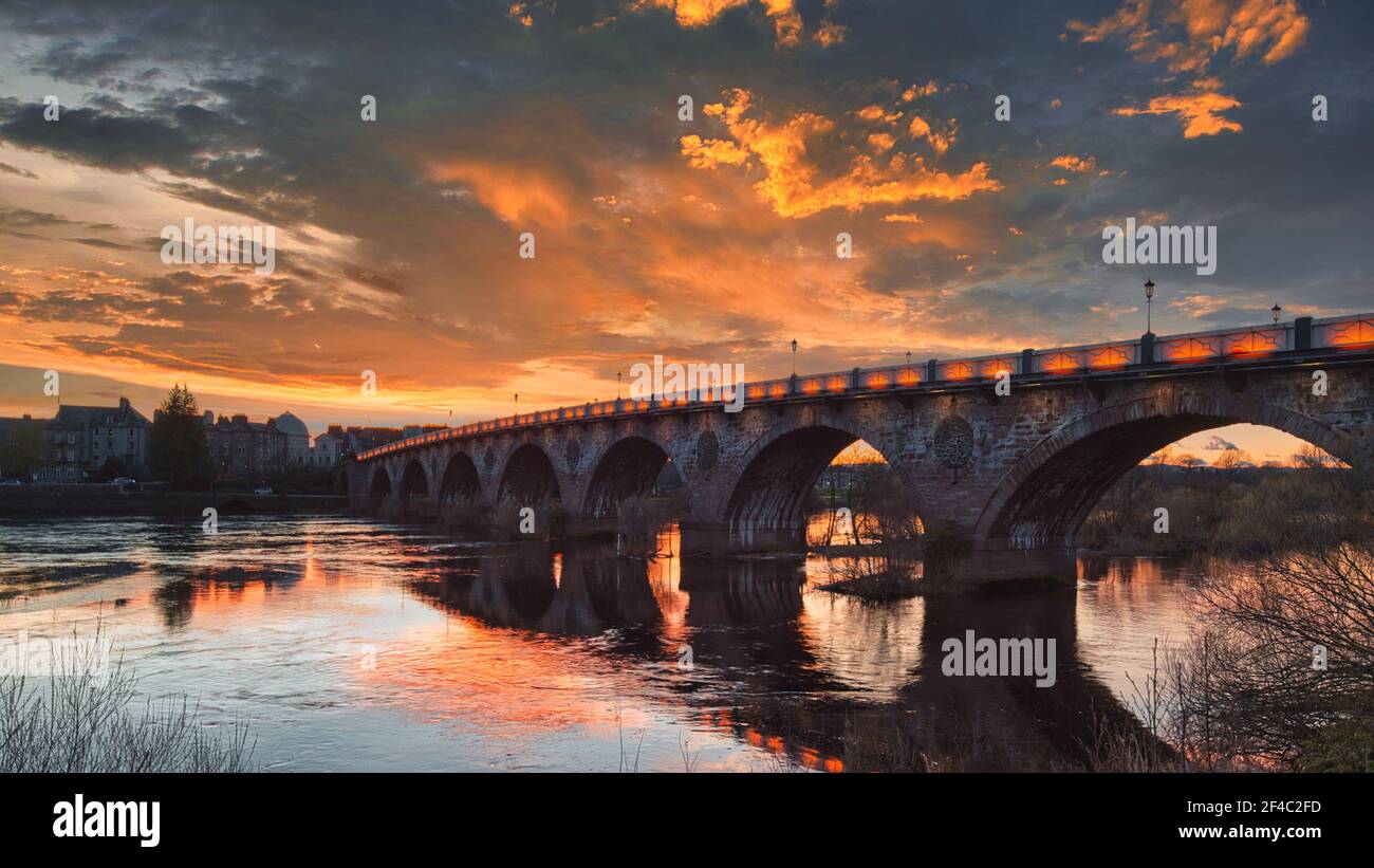 Perth Bridge Scotland, seen with a fiery sky at sunset set Stock Photo ...