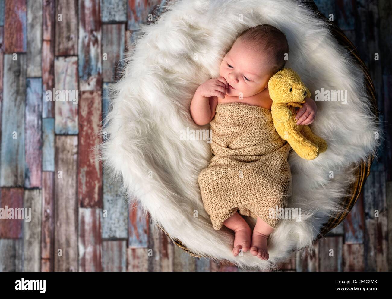 Adorable little newborn baby hugging his first teddy bear Stock Photo ...
