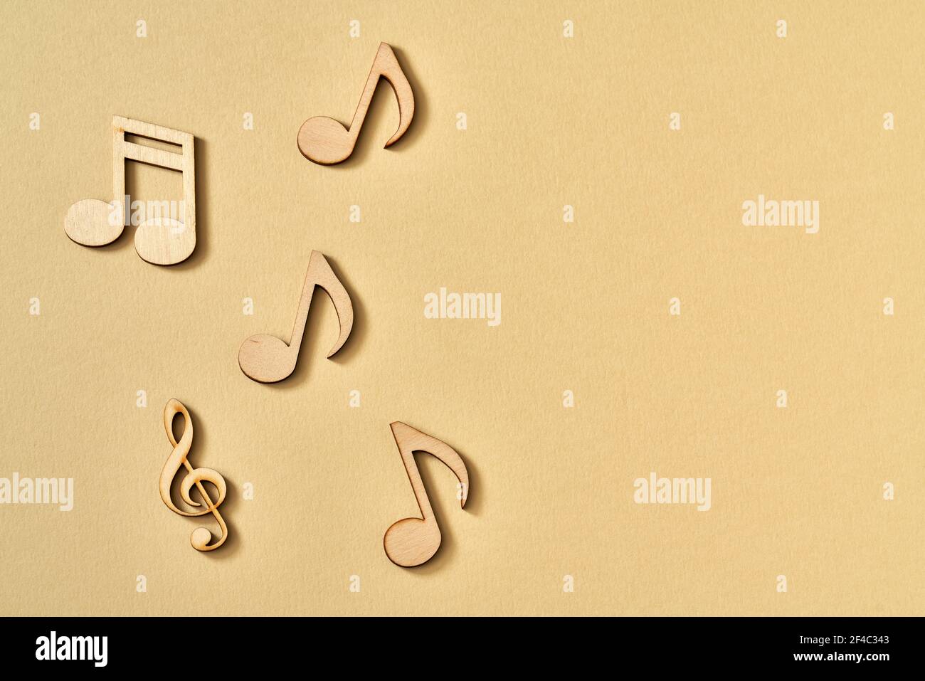 Wooden musical notes on a beige background with copy space Stock Photo ...