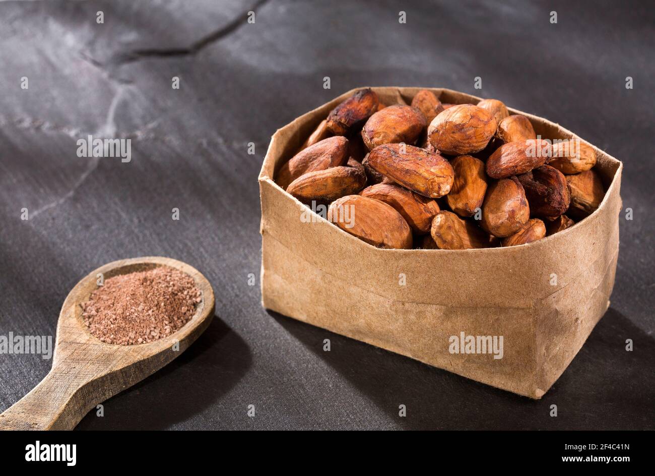 Cocoa bean with a paper-bag - Theobroma cacao Stock Photo - Alamy