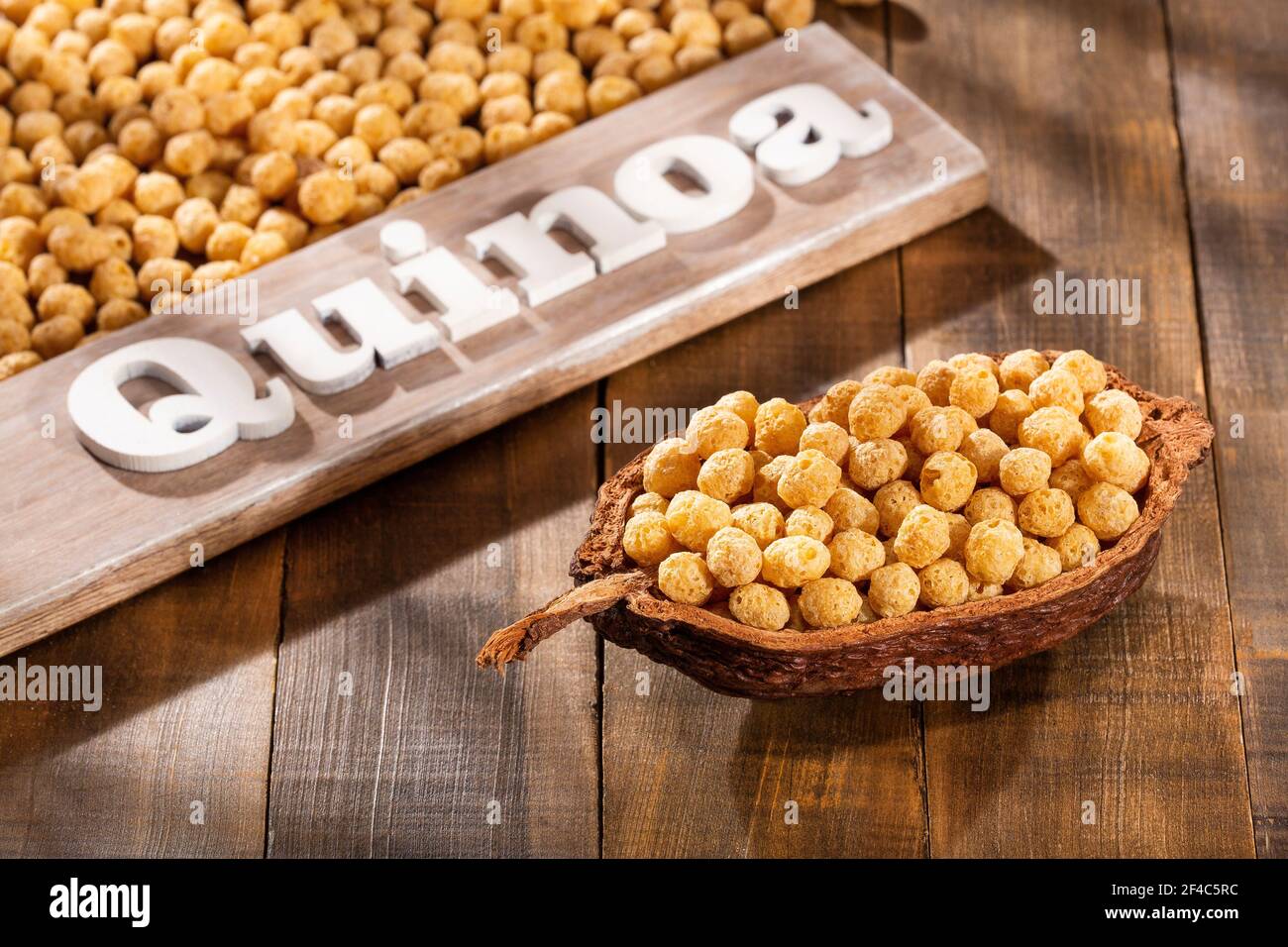 Quinoa pop seeds - Quinoa word in wooden letters Stock Photo - Alamy
