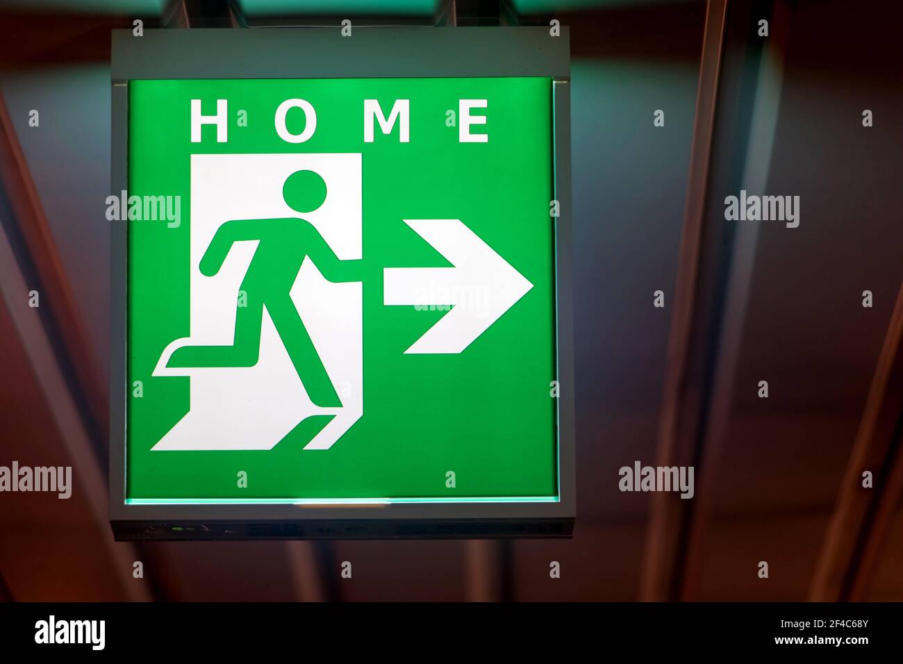The emergency exit sign indicates the direction of way to home Stock ...