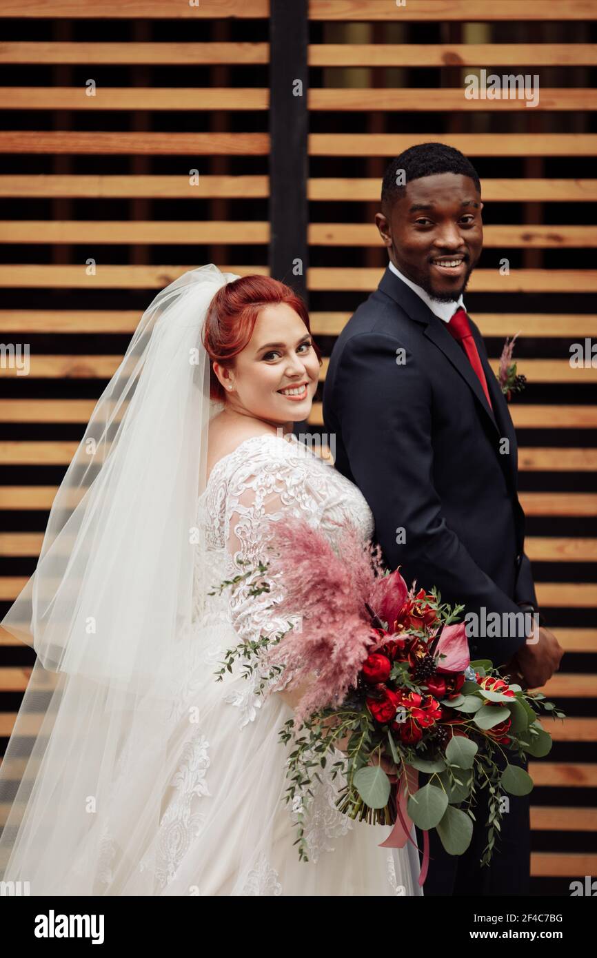 Adorable couple on wedding day, beautiful bride cuddle with charming ...