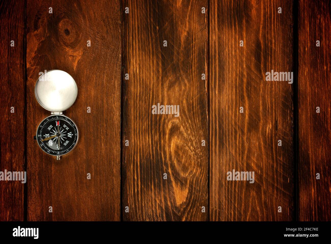 compass on the brown wooden table background Stock Photo - Alamy