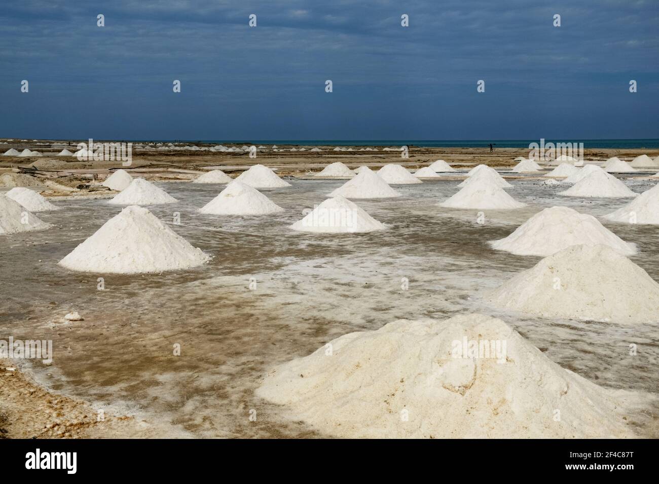 Salt mounds at the Manaure Salt Flats in the desert landscape in La ...