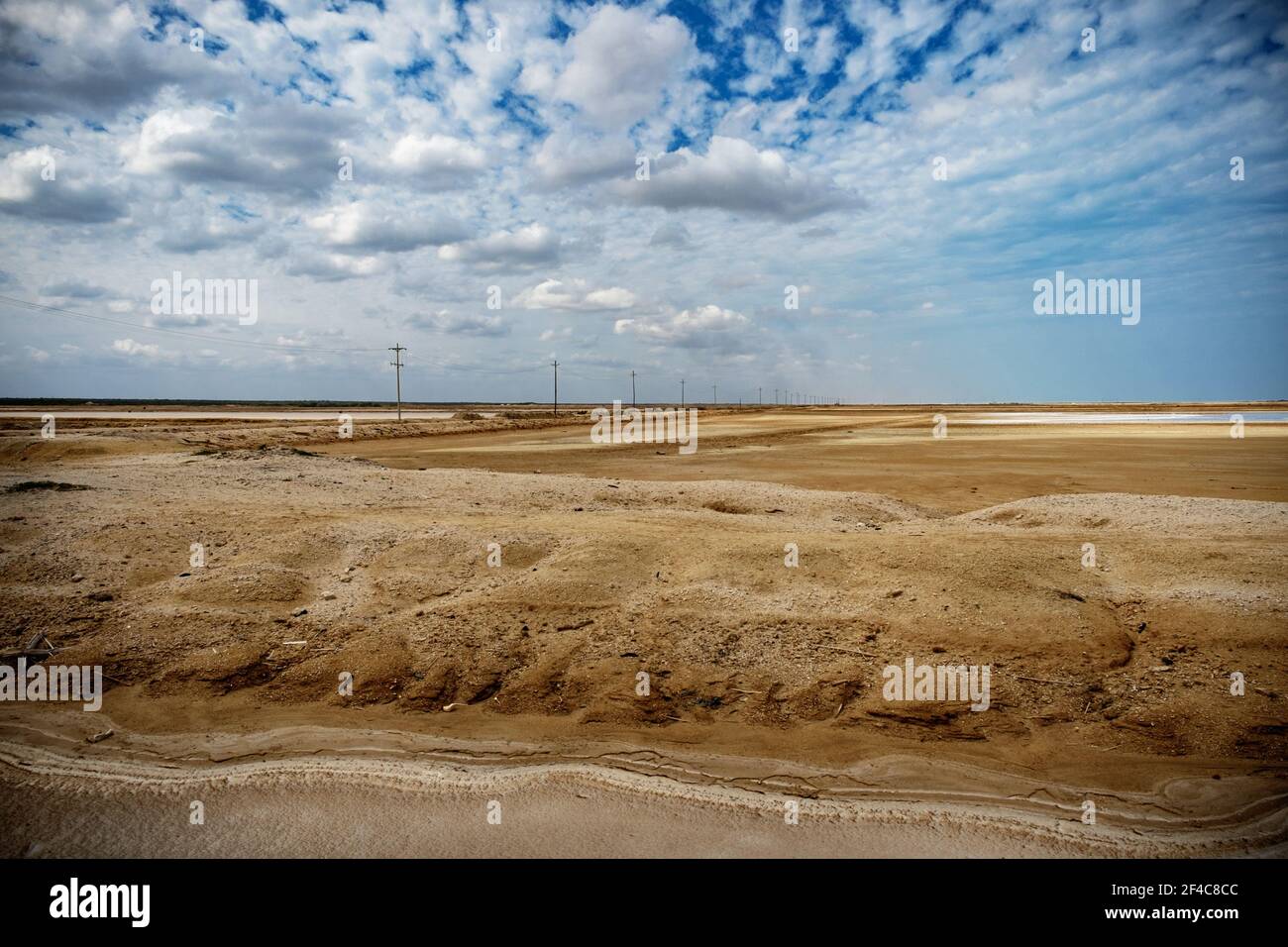 Clouds tower of the open desert at the Manaure Salt Flats in La Guajira ...