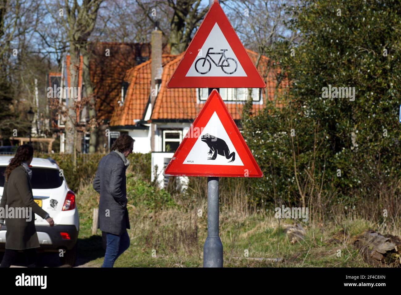 Netherlands, Bergen, March 19, 2021. Warning signs for cyclists and ...