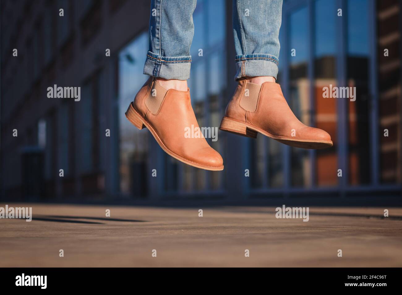Female legs with leather shoes jumping. Woman in leather boot ...