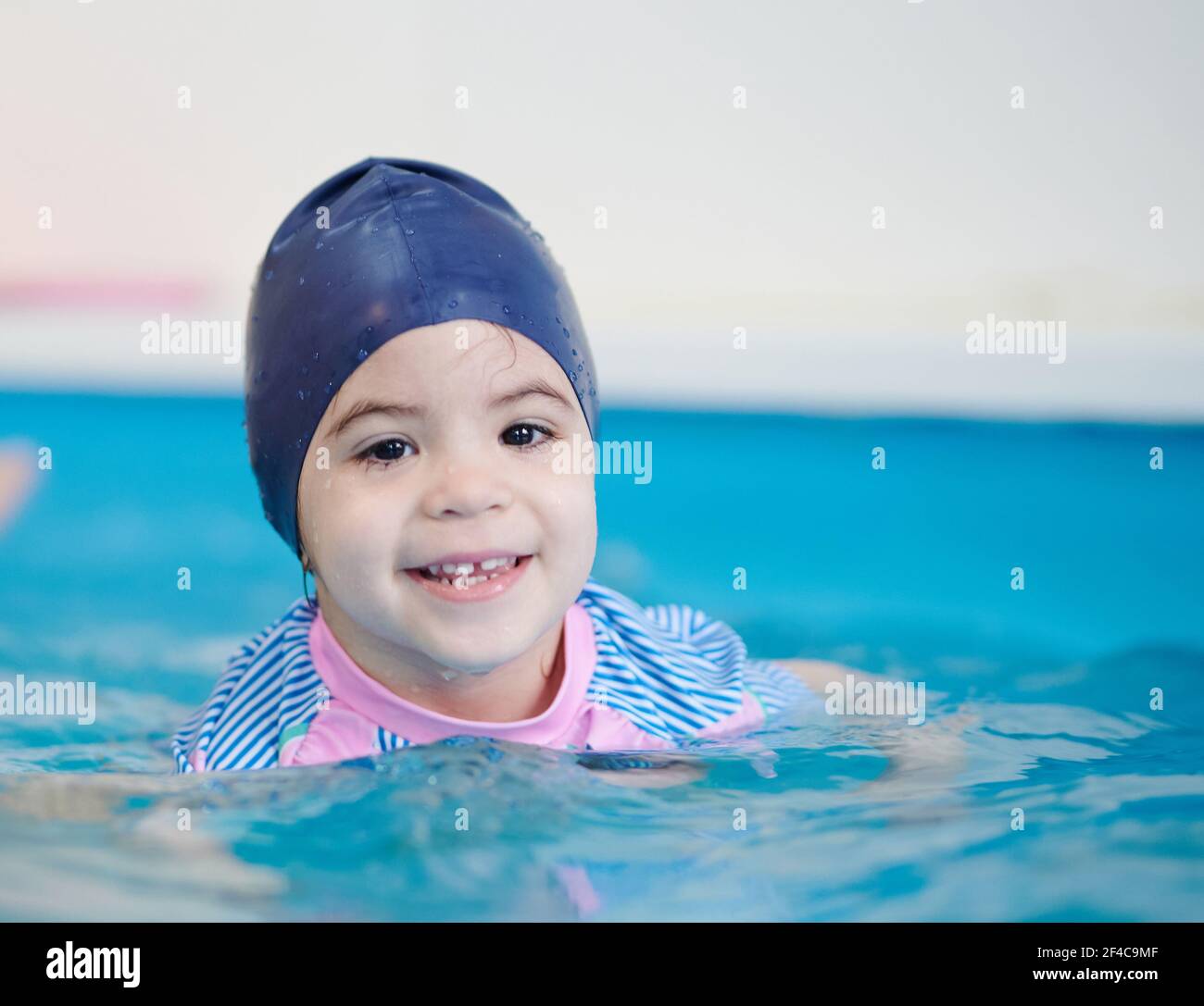 Portrait of child in swim suit in pool water close up view Stock Photo ...