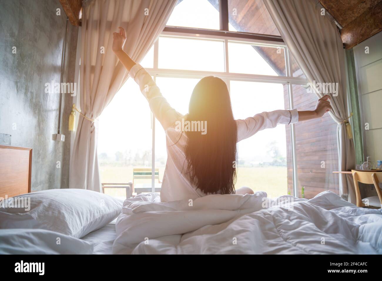 Beautiful Asian Women Is Waking Up In The Morning Stretches In The Bed