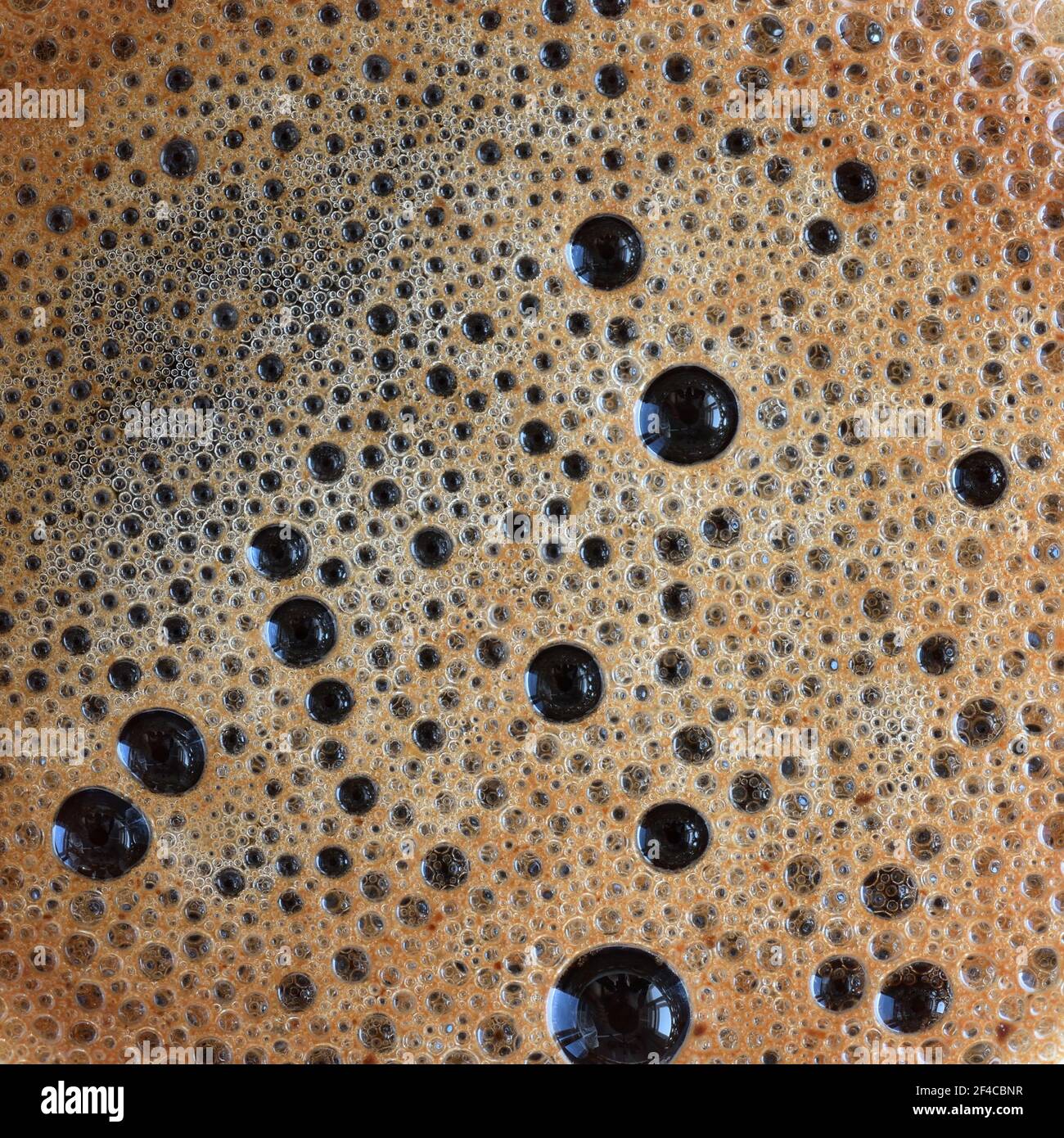Thick coffee foam closeup background top view Stock Photo - Alamy