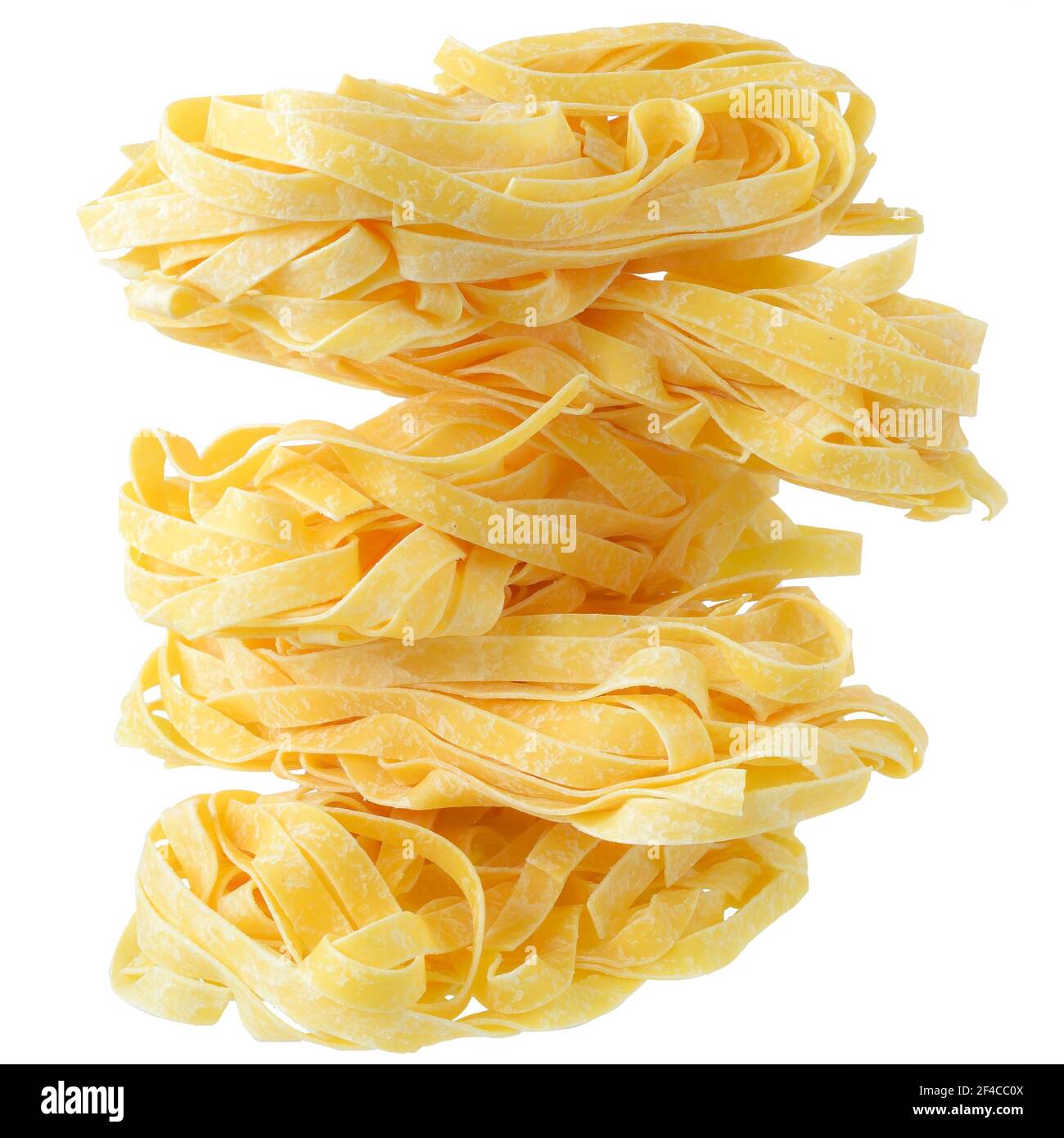 Fettuccine pasta nests close up on a isolated white background Stock ...