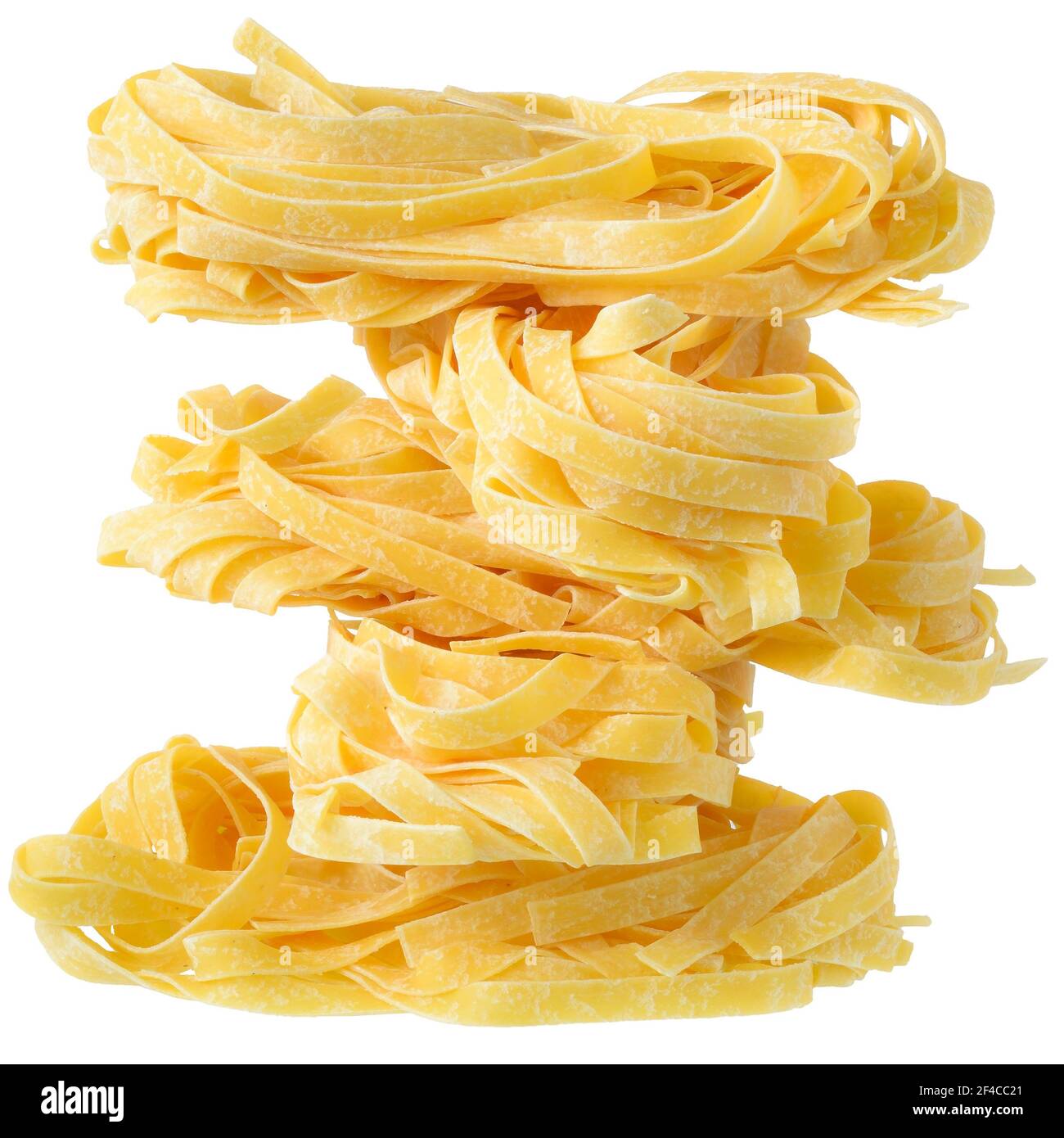 Fettuccine pasta nests close up on a isolated white background Stock ...