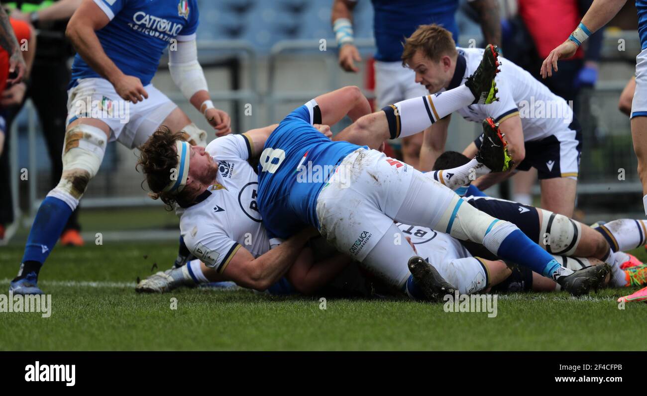 Scotland's David Cherry (hidden) scores their first try of the match ...
