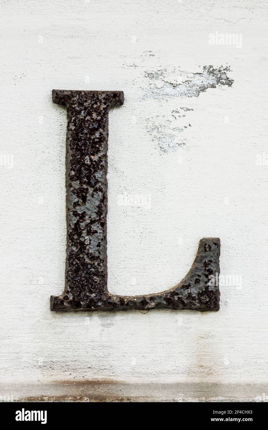 Rusted letter L with serifs Stock Photo - Alamy