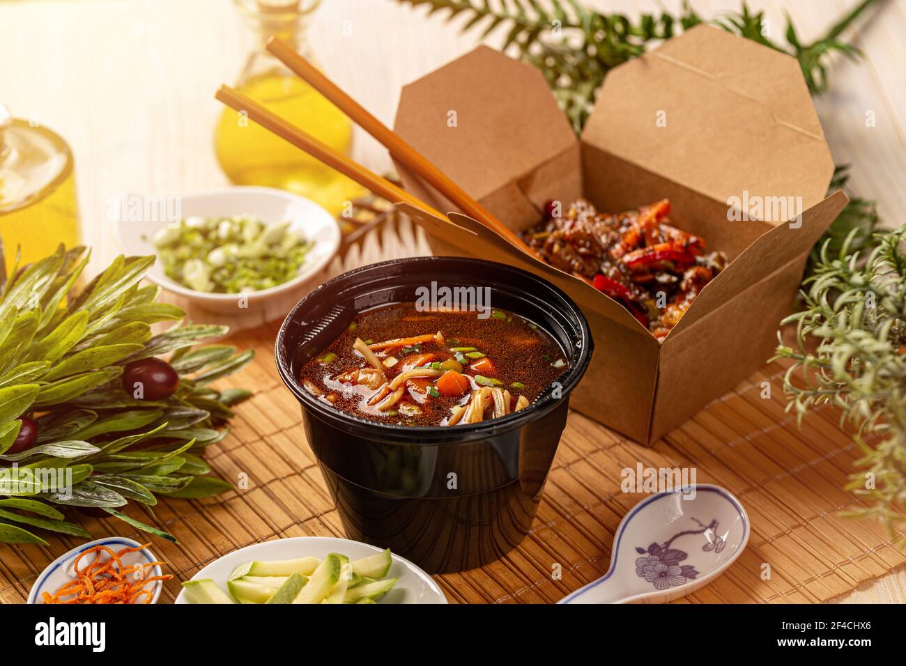 Delivery image, Chinese food in boxes, soup and main course Stock Photo ...